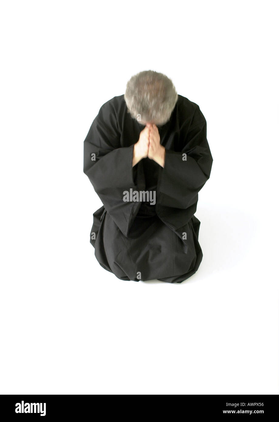 Man kneeling head down hi-res stock photography and images - Alamy