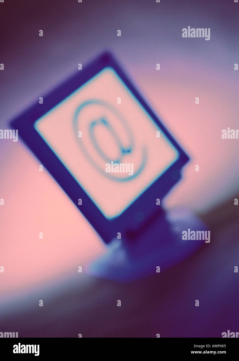 Computer screen with @ symbol, blurred Stock Photo - Alamy