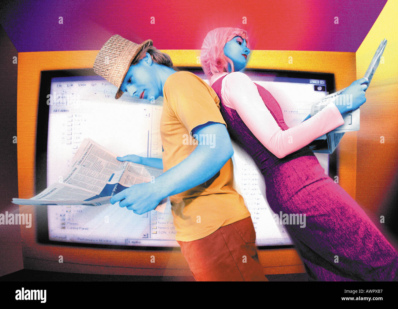 Man and woman reading newspapers back to back in front of monitor ...