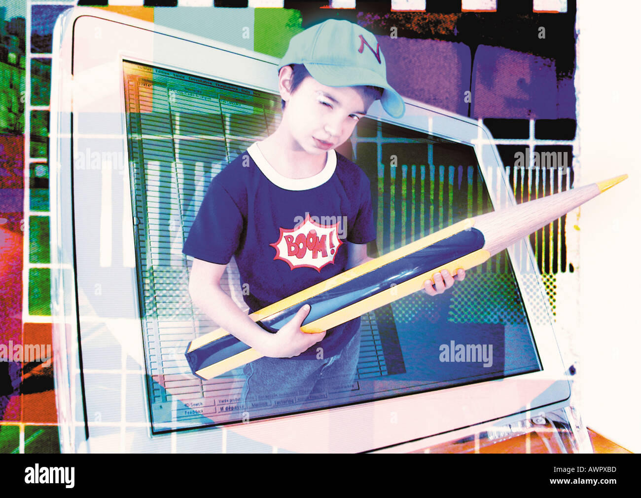 Young boy holding oversized pencil, emerging from computer monitor ...