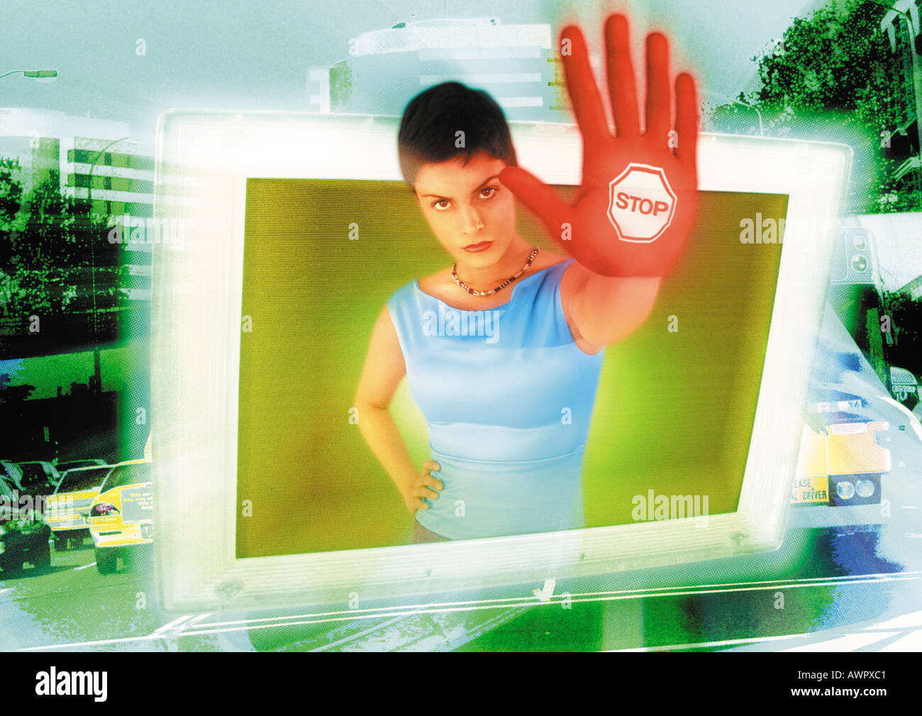 Young woman emerging from computer monitor, hand toward camera, the ...