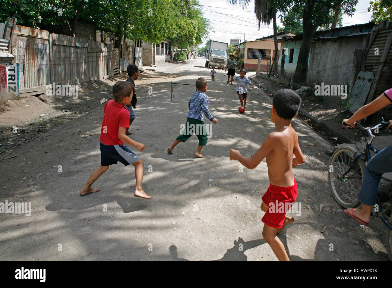 HONDURAS Boys playing football The slum barrio of Chamelecon San Pedro ...