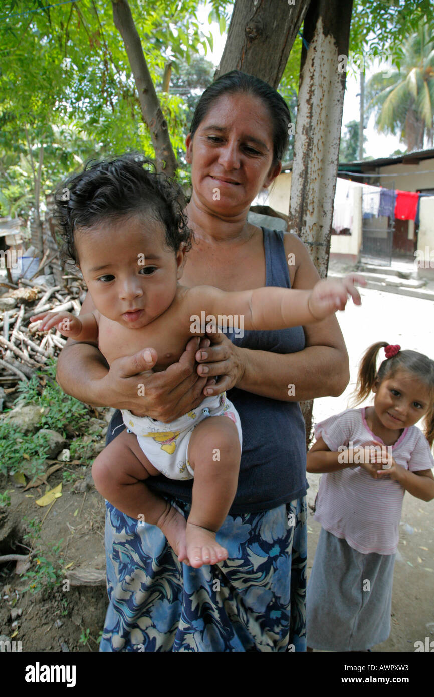 HONDURAS Woman with children The slum barrio of Chamelecon San Pedro ...