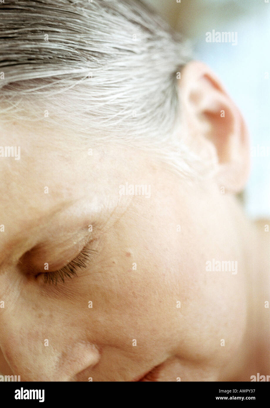 Mature woman, eyes closed, partial view of face, close-up Stock Photo ...
