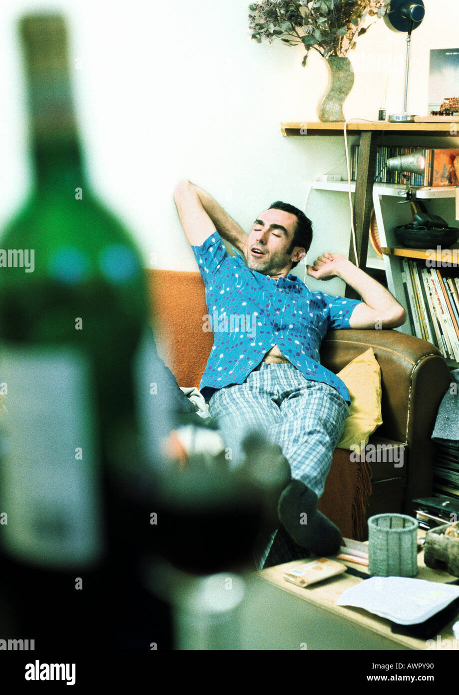 Slouching on sofa hi-res stock photography and images - Alamy