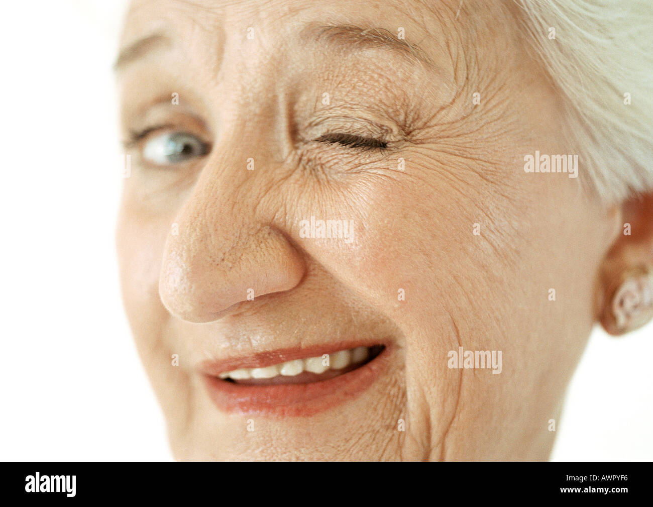 Senior woman winking at camera, portrait, close-up Stock Photo - Alamy
