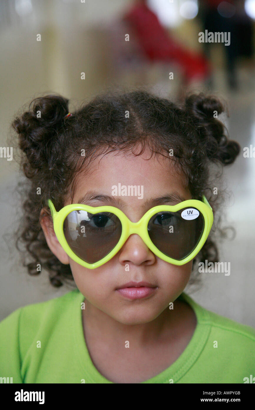 HONDURAS Girl with sunglasses The slum barrio of Chamelecon San Pedro ...