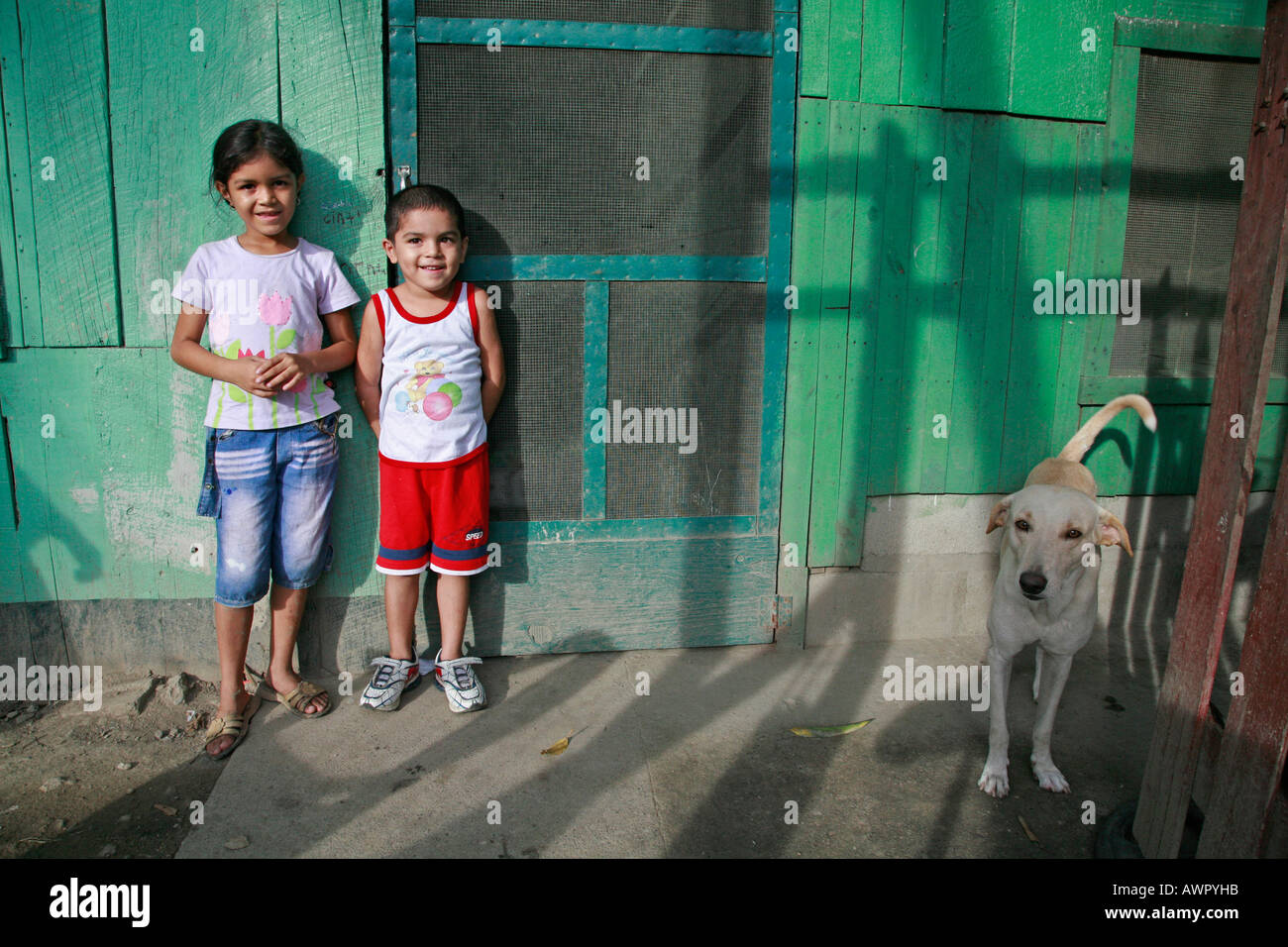 HONDURAS Children and dog The slum barrio of Chamelecon San Pedro Sula ...