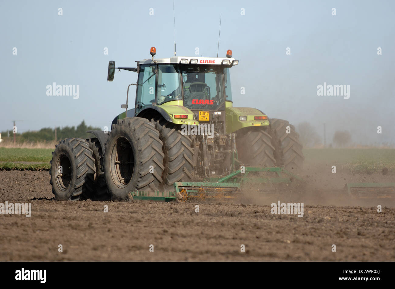 Claas Tractor preparing land for planting Stock Photo - Alamy