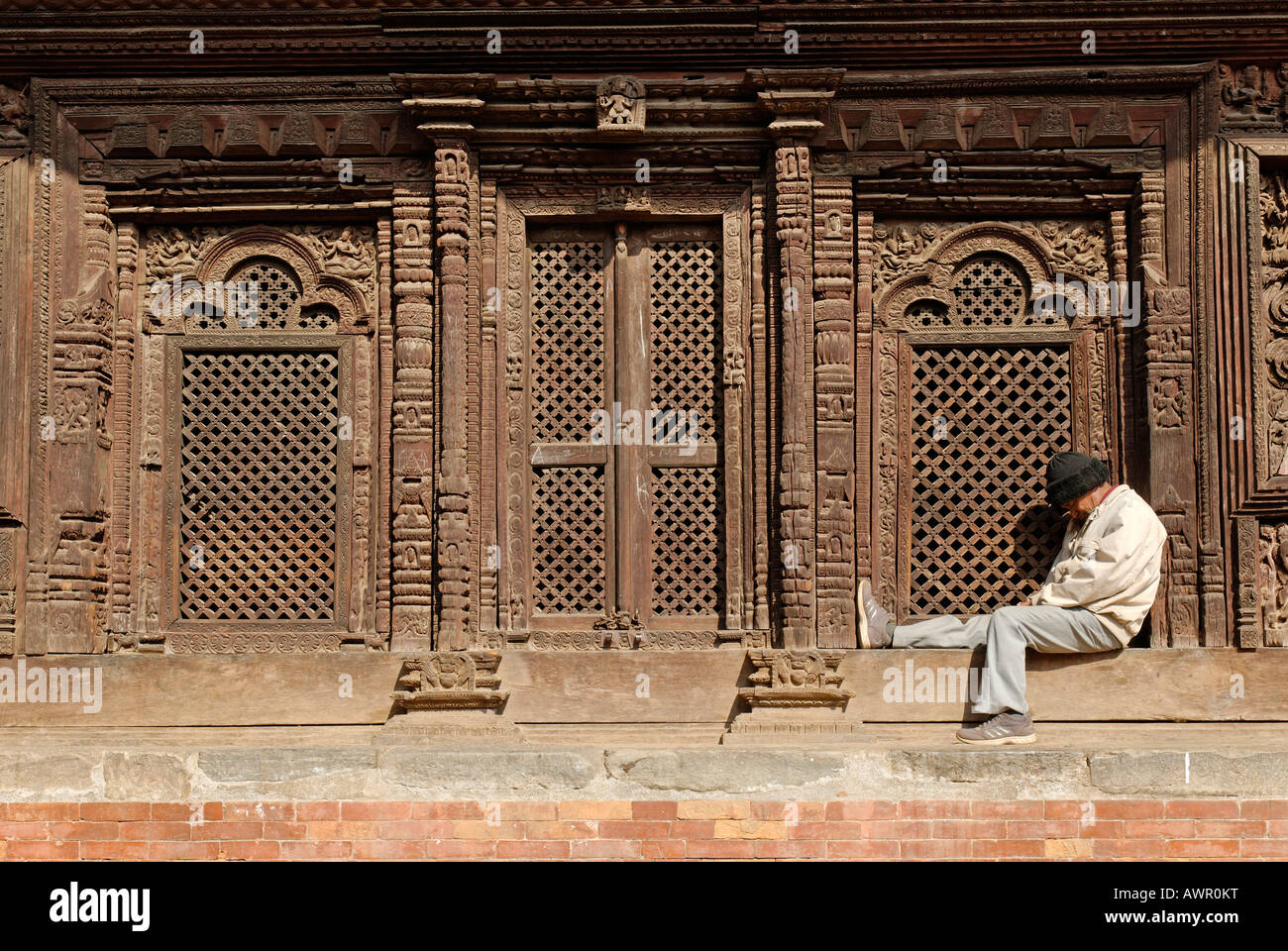 Man sleeping in front of a temple, Durbar Square of Patan, Lalitpur ...