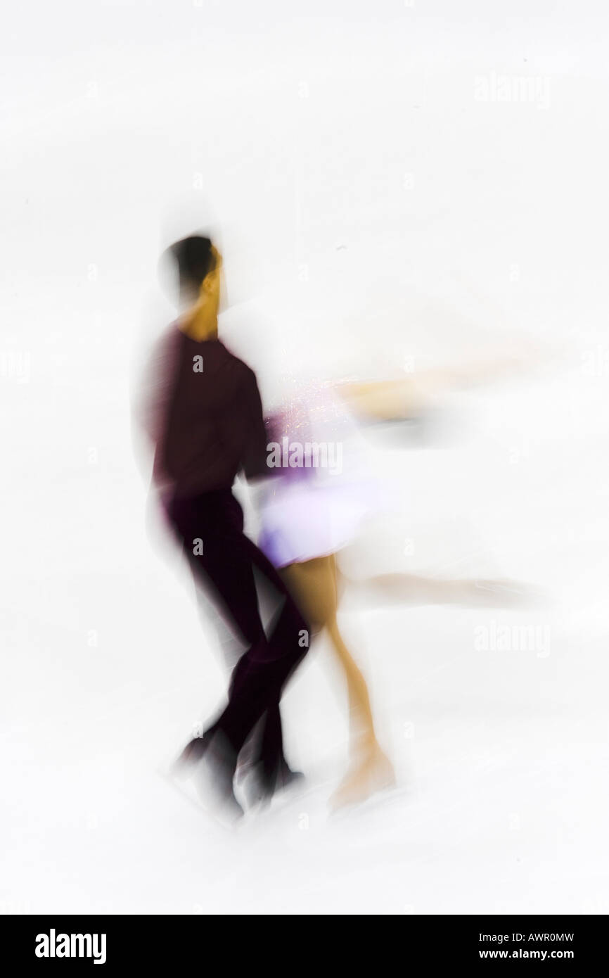 Blurred action of pairs figure skaters Stock Photo - Alamy