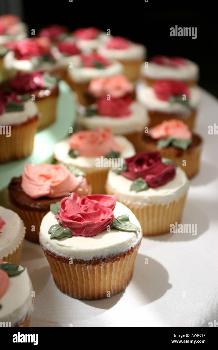 One cupcake in sharp focus of many cupcakes on display. Photo by Tom ...