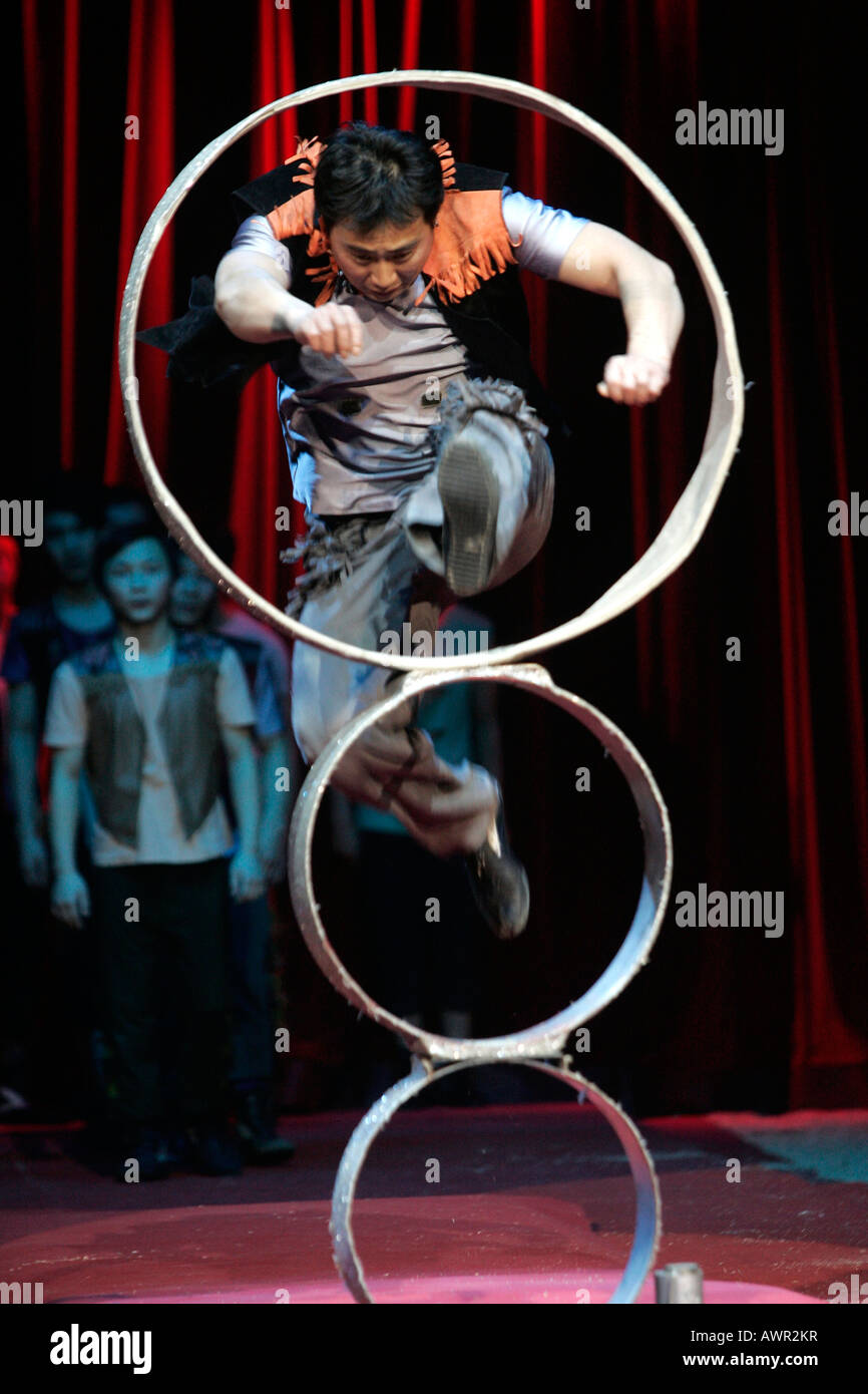 An artist of the group "Hoops" jumps through a hoop. Stuttgart, Baden ...