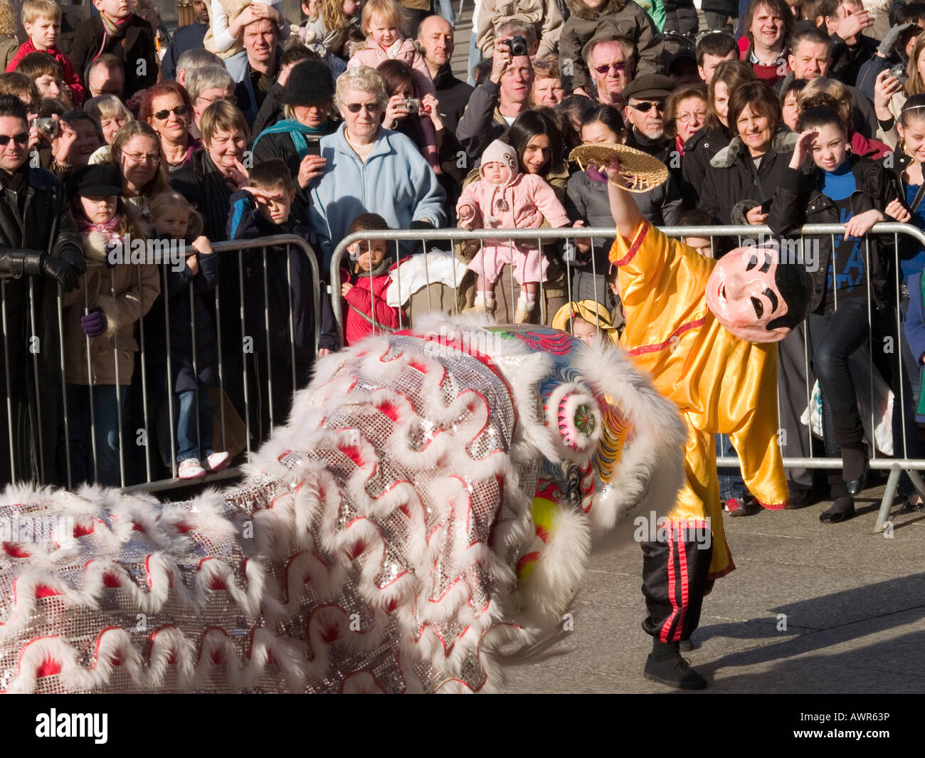 A crowd of people watching a Dragon Dance, as part of the Chinese New ...