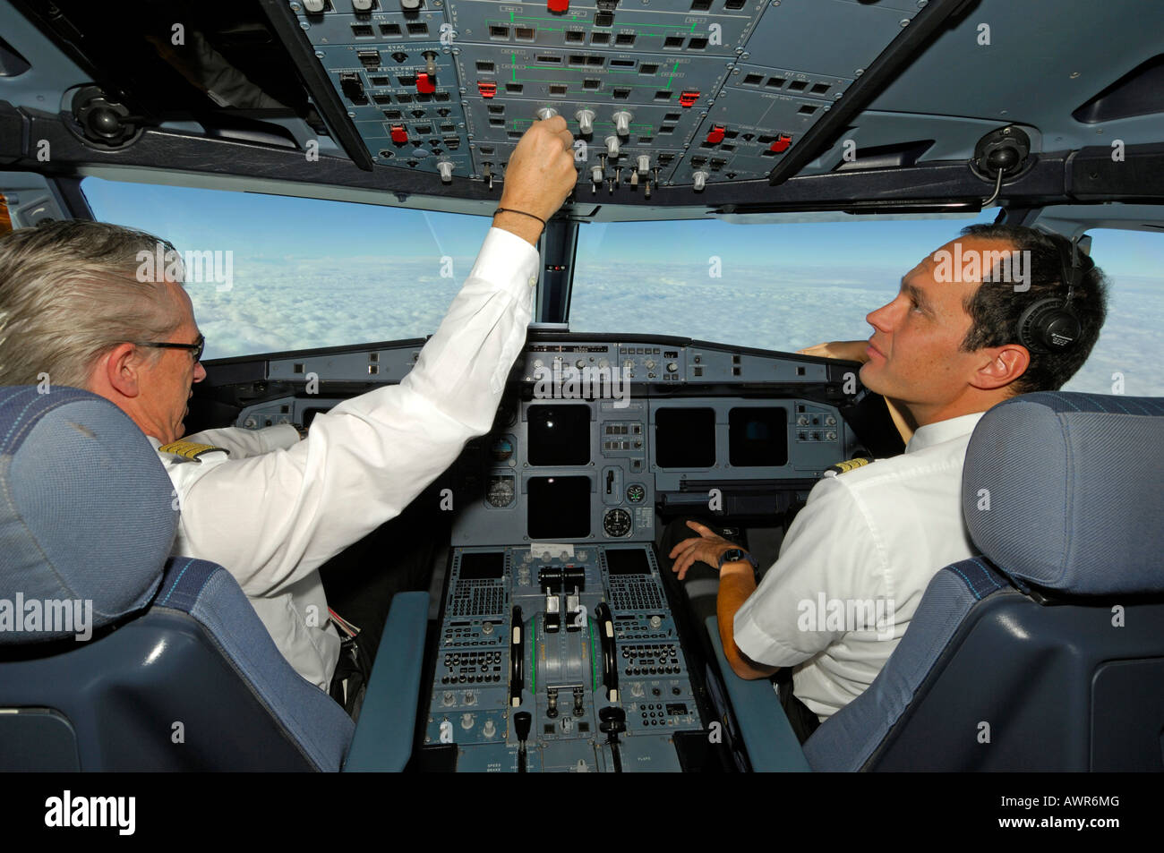 Pilots in the cockpit of an Airbus 321, in flight Stock Photo - Alamy