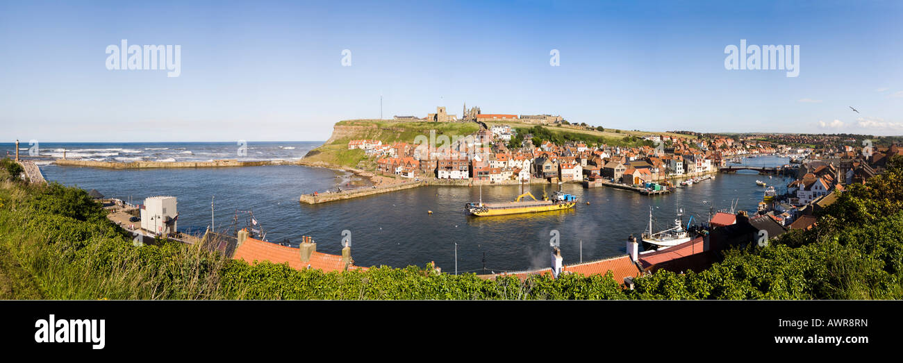 A panoramic view of the River Esk flowing through the harbour at Whitby ...