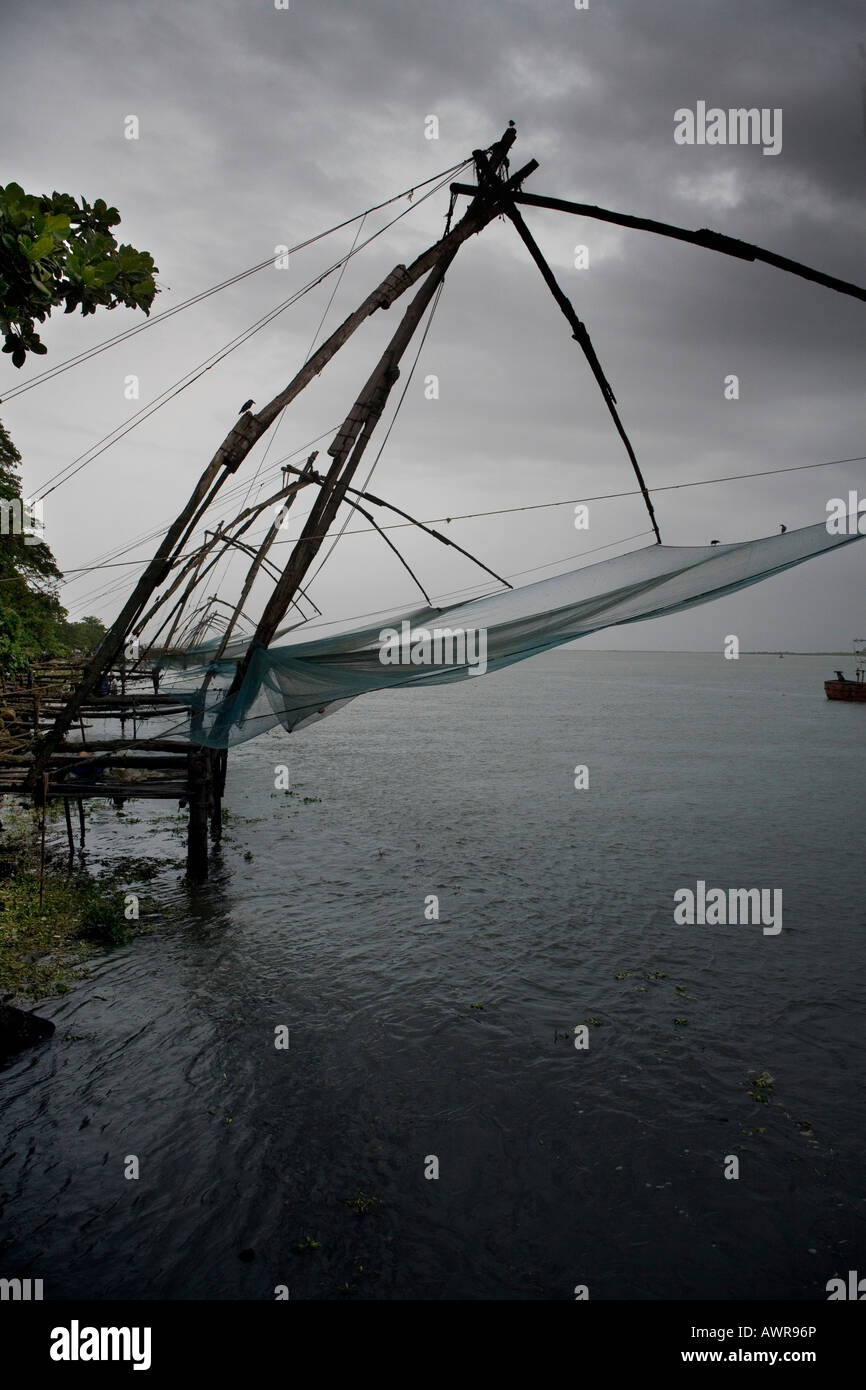 Chinese Fishing Nets Cheenavala suspended in mid air at twilight after ...
