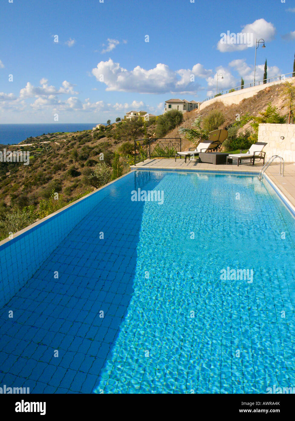 Infinity swimming pool in sunny Cyprus by the sea Stock Photo - Alamy