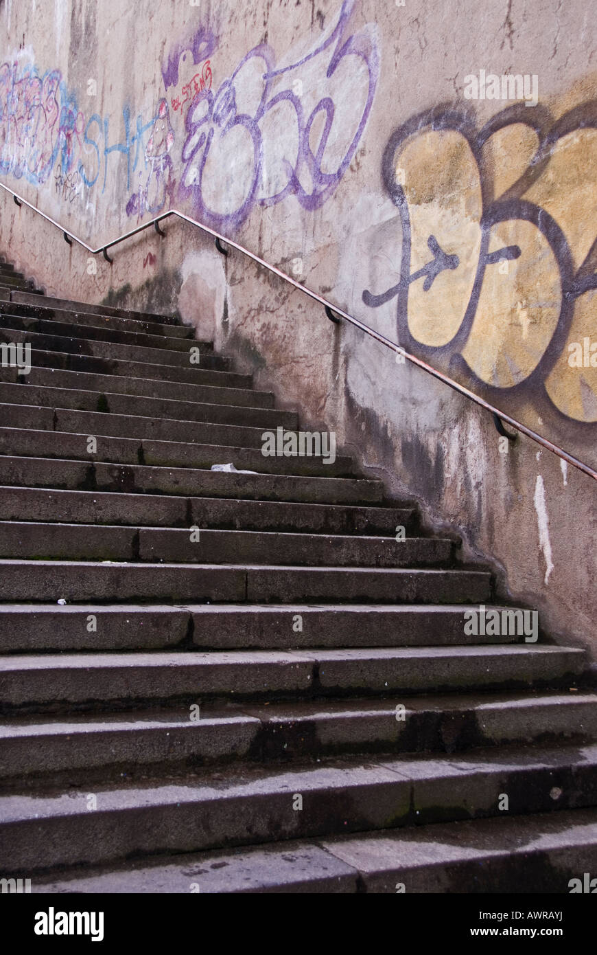 Stock photo Graffiti painted on the side of a dismal urban staircase ...