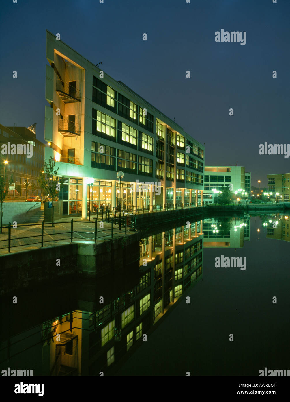 OFFICE BUILDING AT NIGHT REFLECTED IN WATER MODERN ARCHITECTURE CARDIFF ...