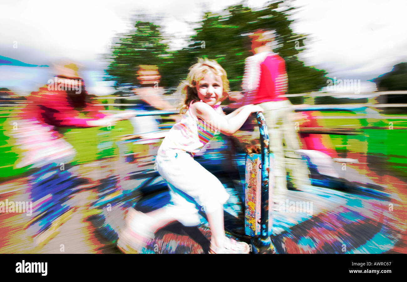 Little girl on roundabout abstract hi-res stock photography and images ...