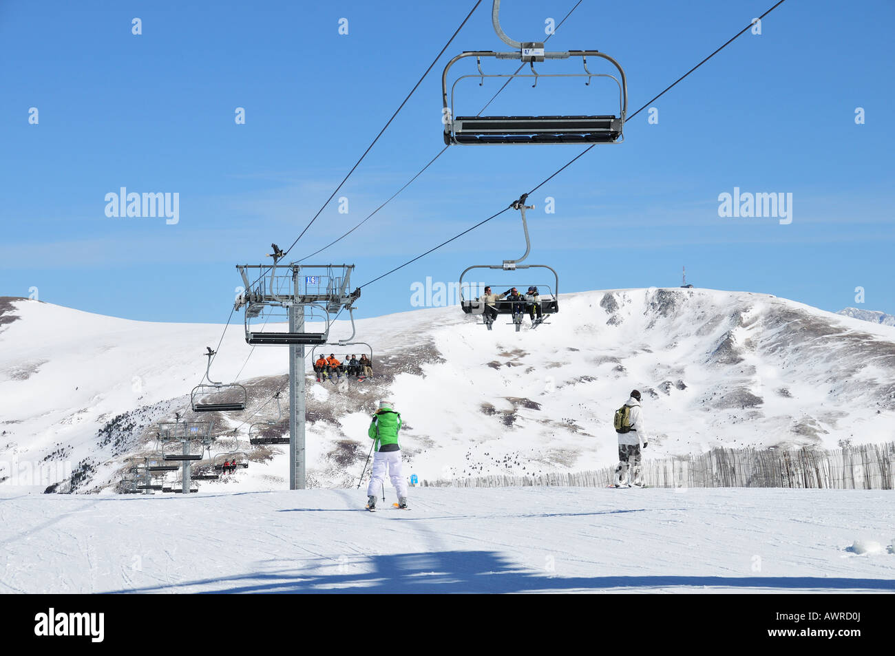 Three people on a ski lift hi-res stock photography and images - Alamy