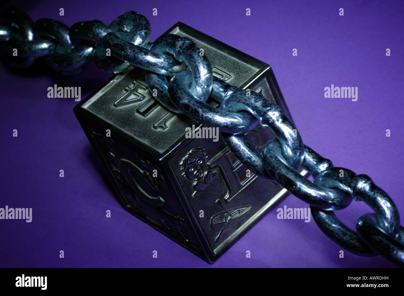 a money box chained down in chains not allowing access to savings or ...