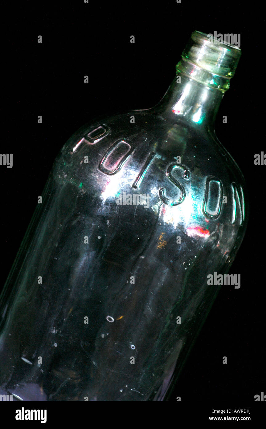 a large poison toxins toxic bottle with poisonous written in relief on ...