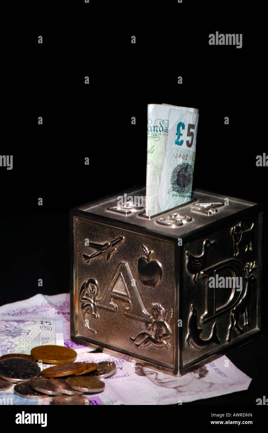 a childrens mony box showing the alphabet stood resting on various ...