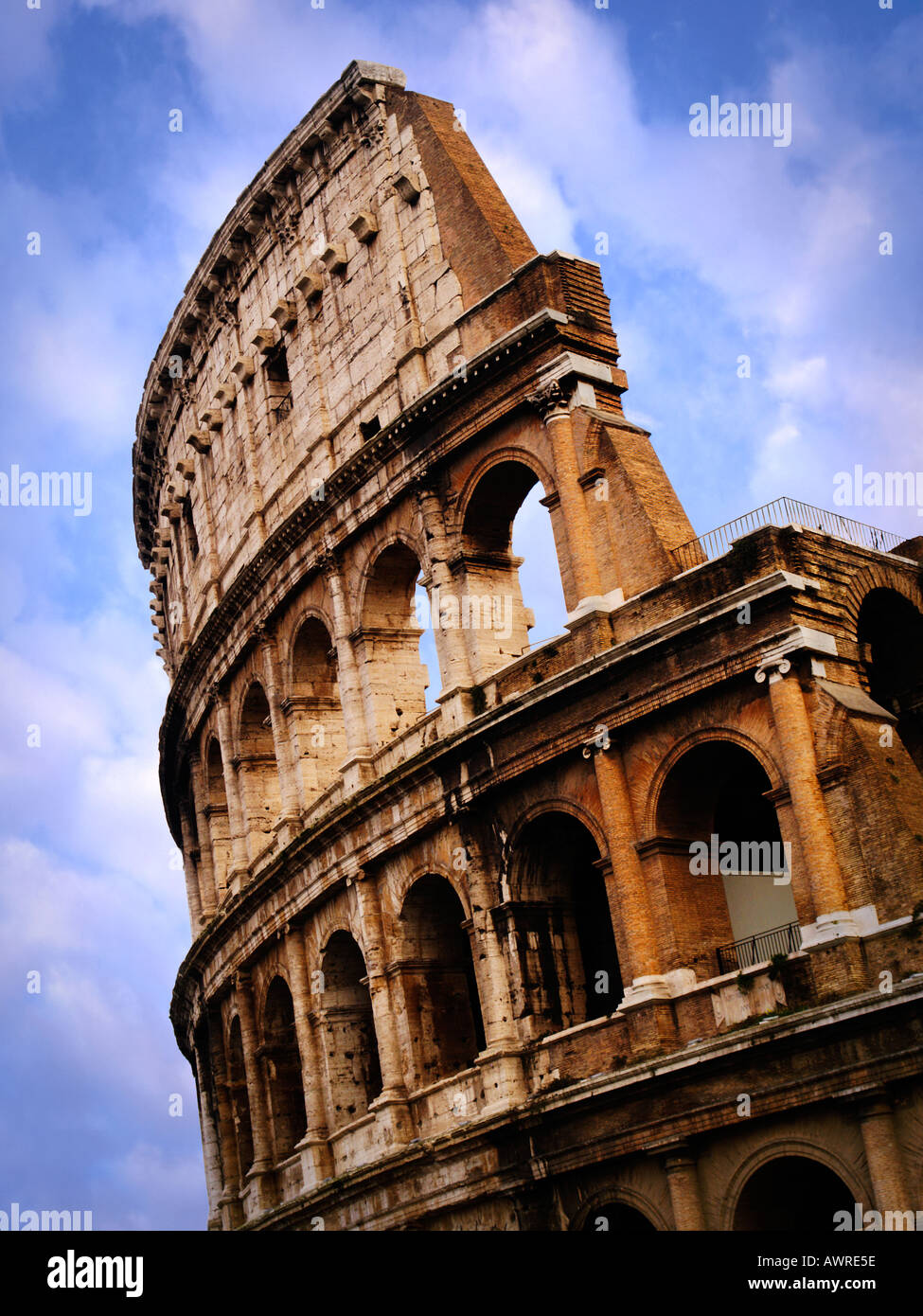 Vertical shot of part of the Colosseum in Rome Lazio Italy with blue ...
