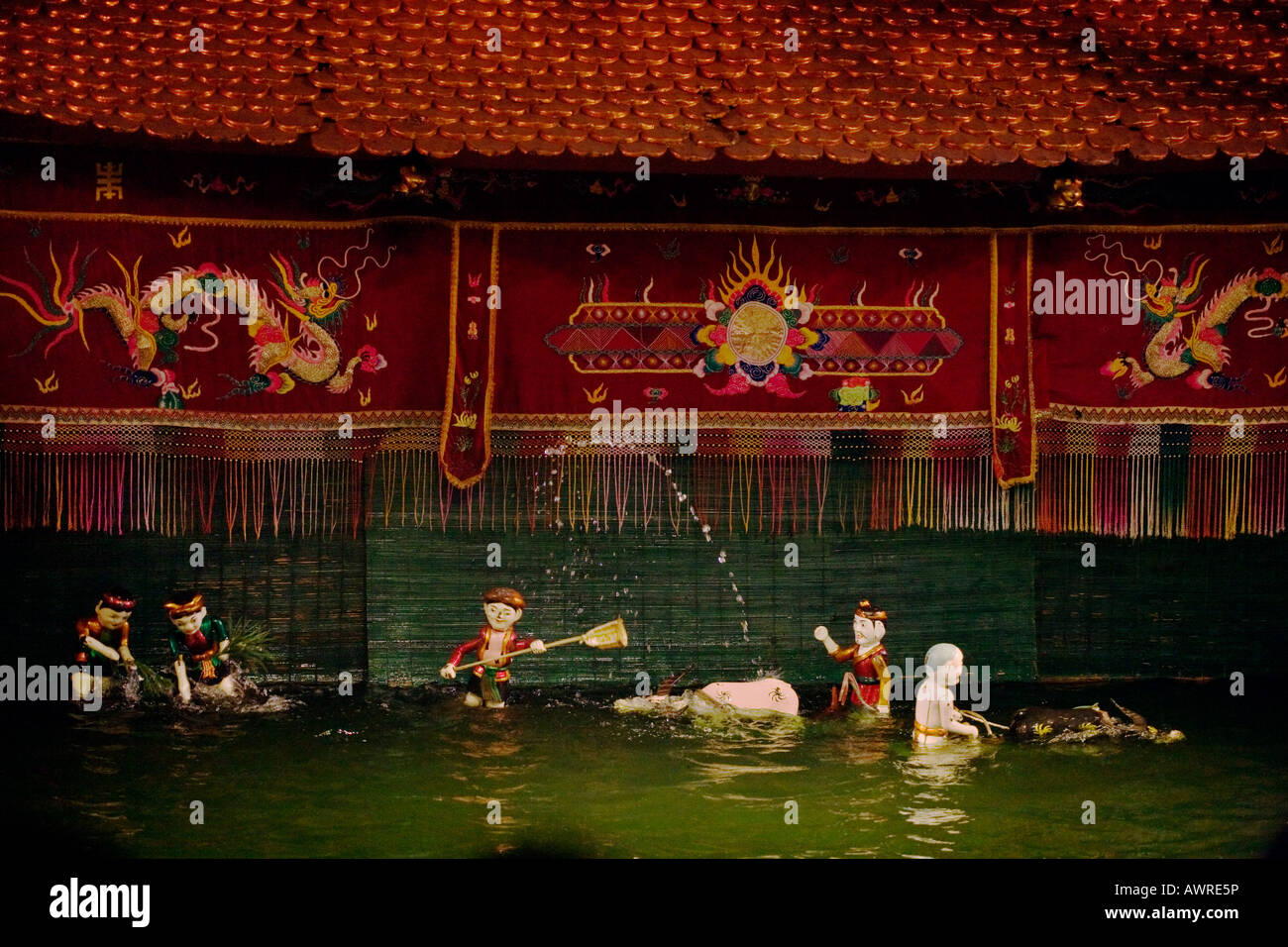 Water Buffalo and a village scene inside the THANG LONG WATER PUPPET ...