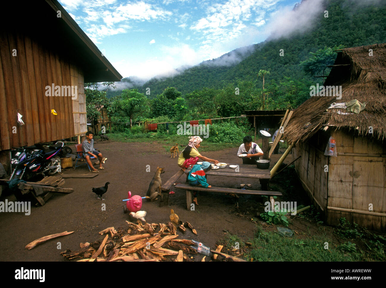 Akha people, woman cooking breakfast, family eating breakfast, ethnic ...