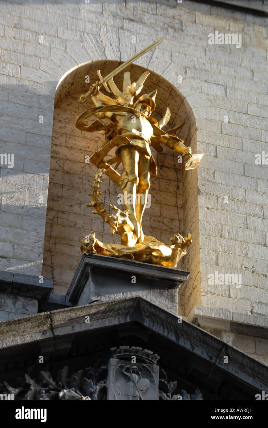A golden statuette above the doorway of a Brussels college in the ...