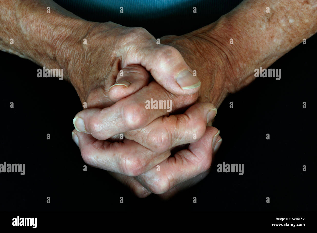 Old clasped hands hi-res stock photography and images - Alamy