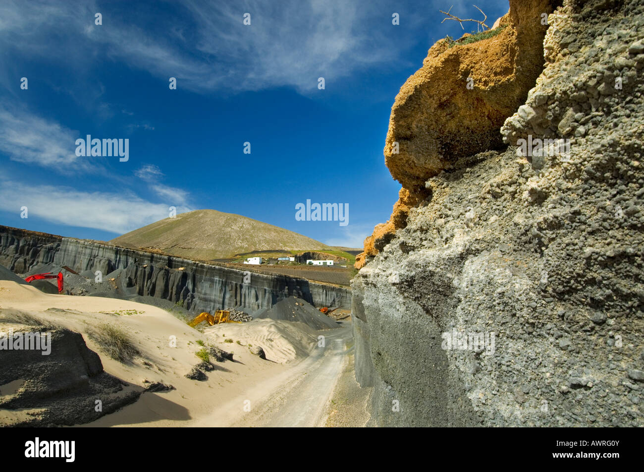 Mechanical digger mining volcanic gravel from volcanic ash a unique ...