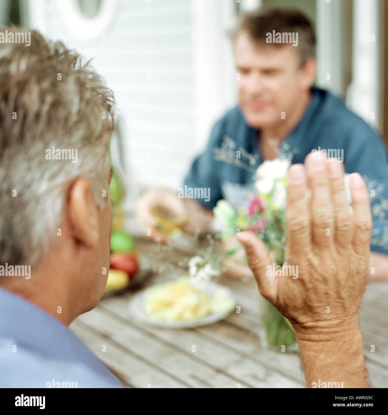 Talking across table dinner hi-res stock photography and images - Alamy