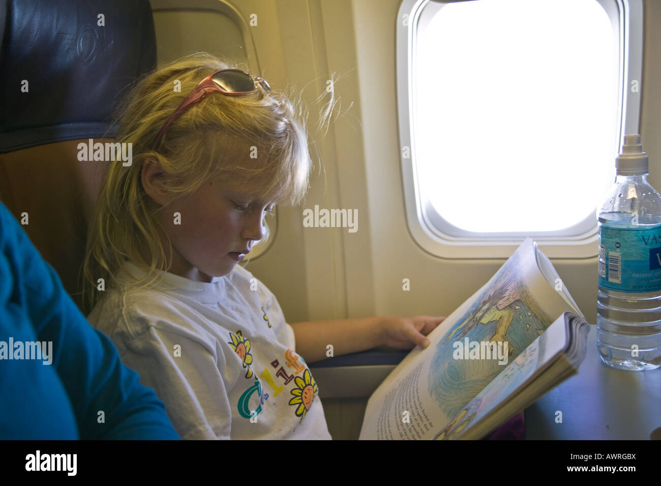 Girl aboard aircraft Stock Photo - Alamy