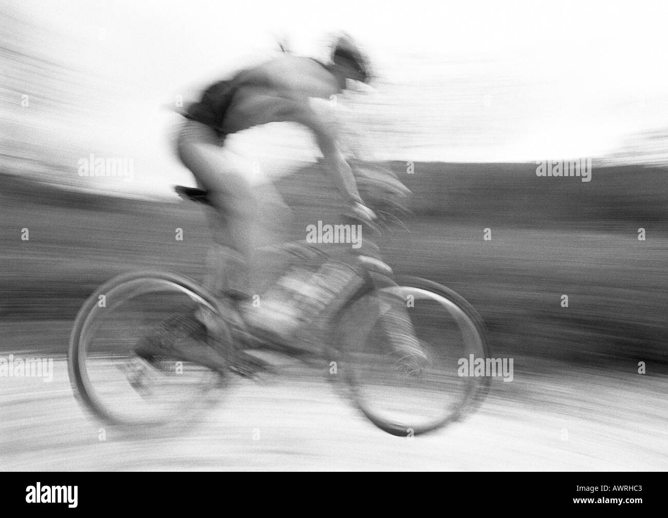 Man cycling, side view, blurred, b&w Stock Photo - Alamy