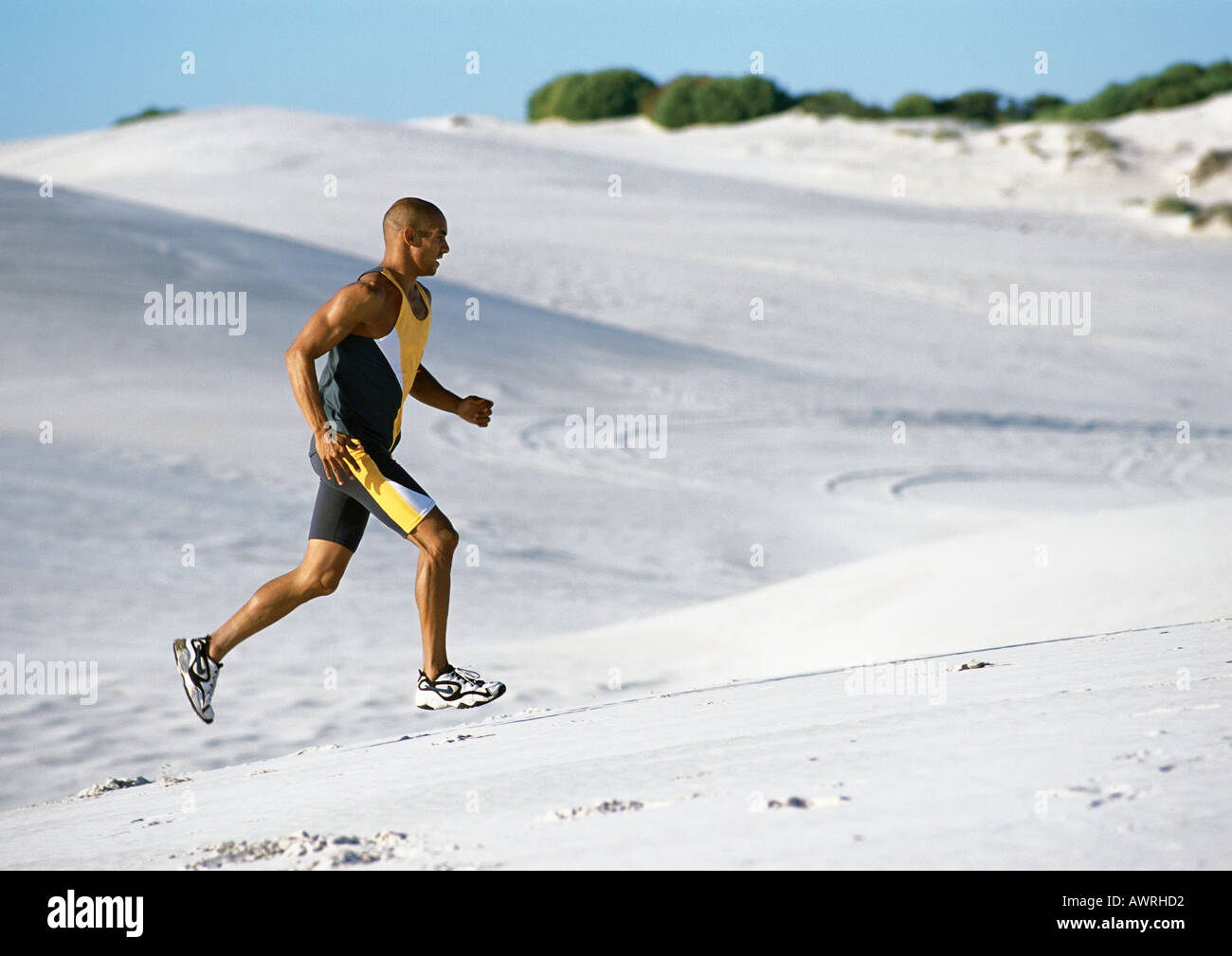 Man jogging on beach Stock Photo - Alamy