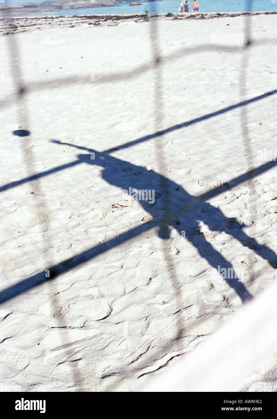 Shadow of someone playing beach volleyball Stock Photo - Alamy