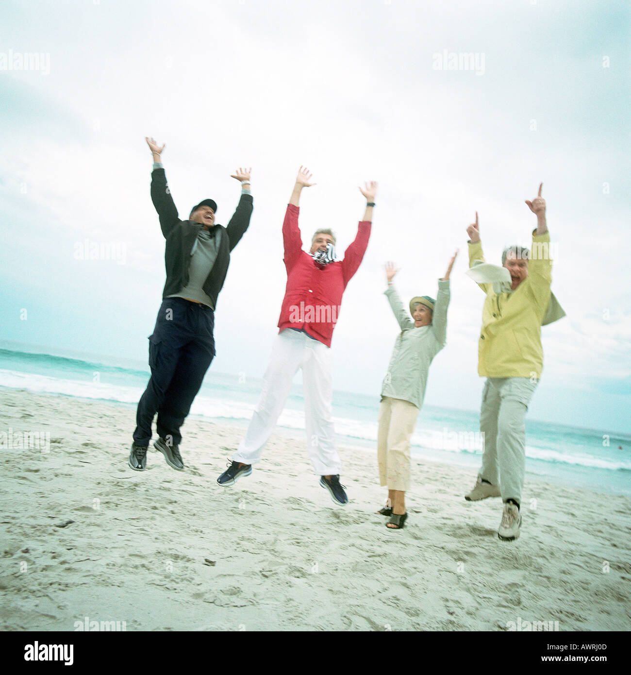 Group of mature adults jumping hi-res stock photography and images - Alamy