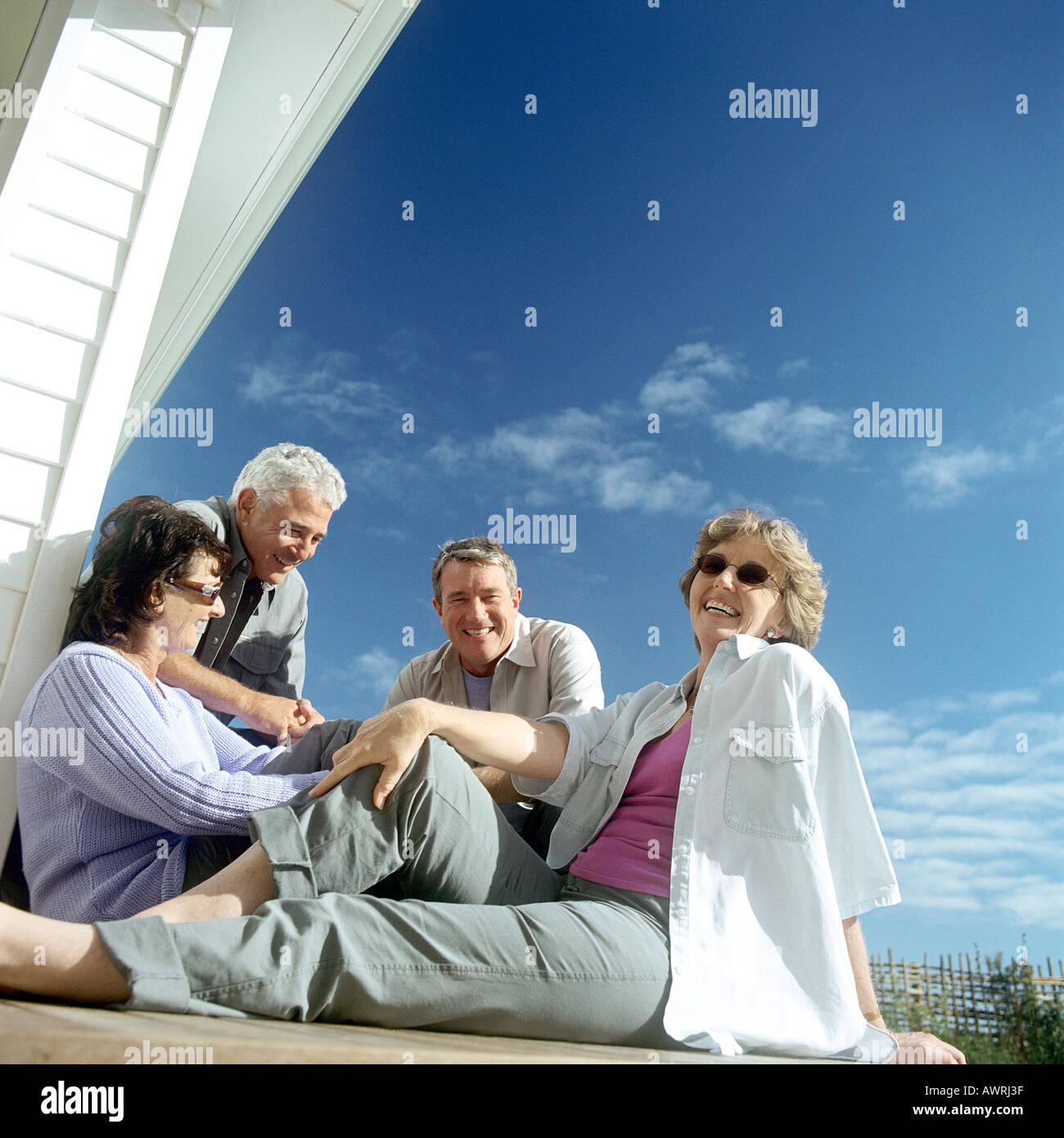 Mature group sitting, smiling Stock Photo - Alamy