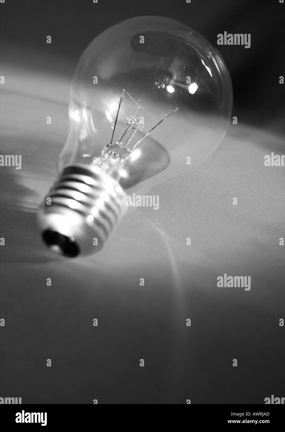 Light bulb lighting up Black and White Stock Photos & Images - Alamy