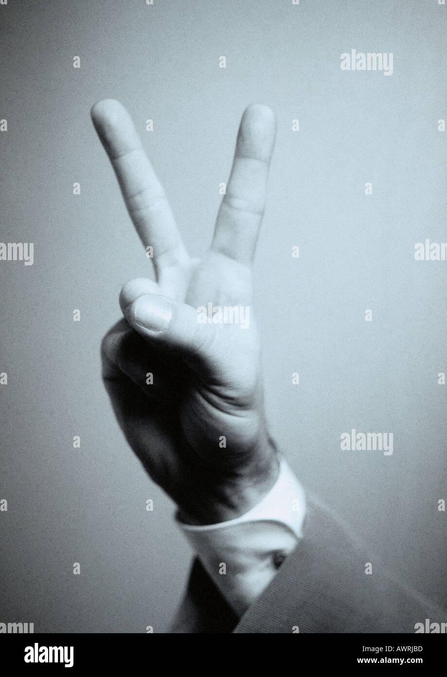 Hand making peace sign, close-up Stock Photo - Alamy