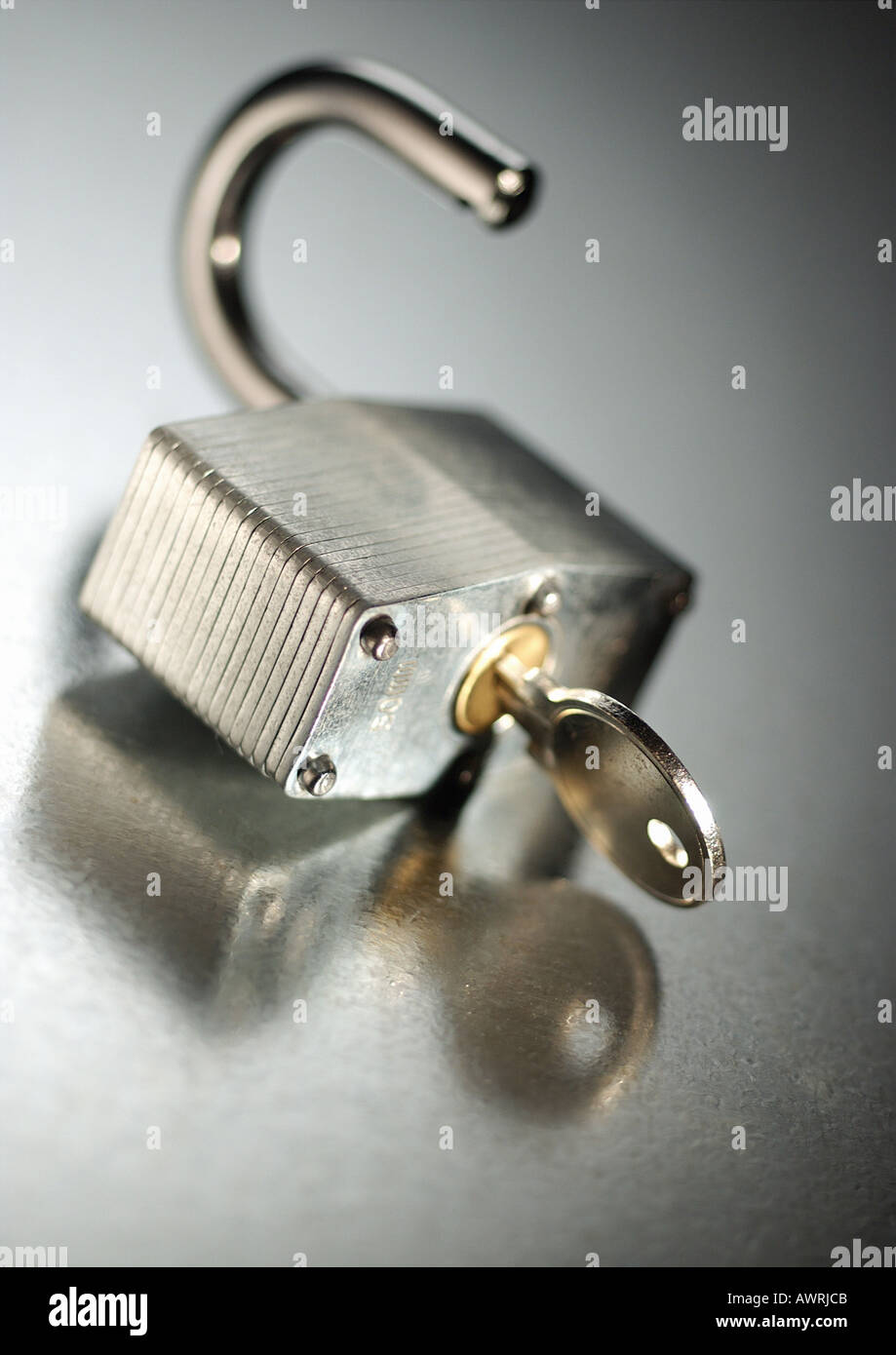 Key in padlock Stock Photo - Alamy