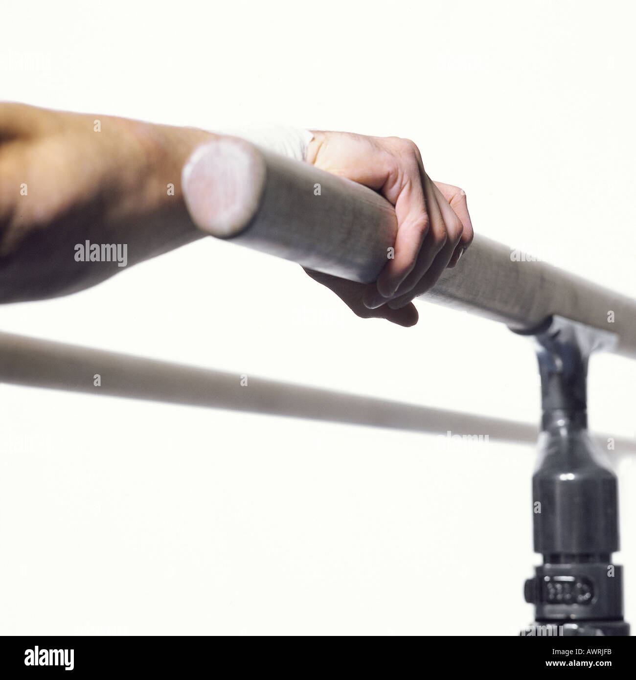 Gymnast's hand grasping parallel bar, close-up Stock Photo - Alamy
