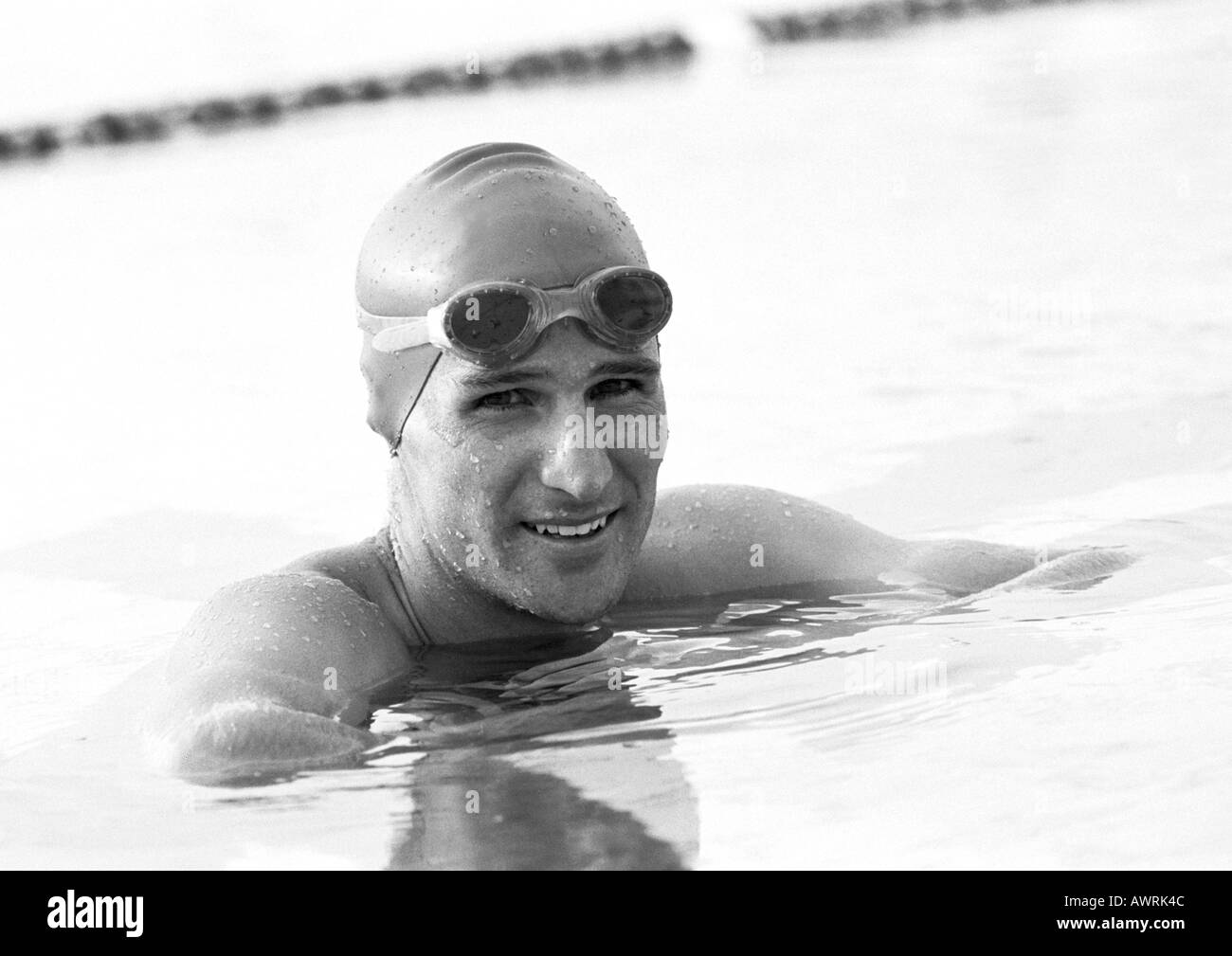Male swimmer smiling in water, close-up, b&w Stock Photo - Alamy