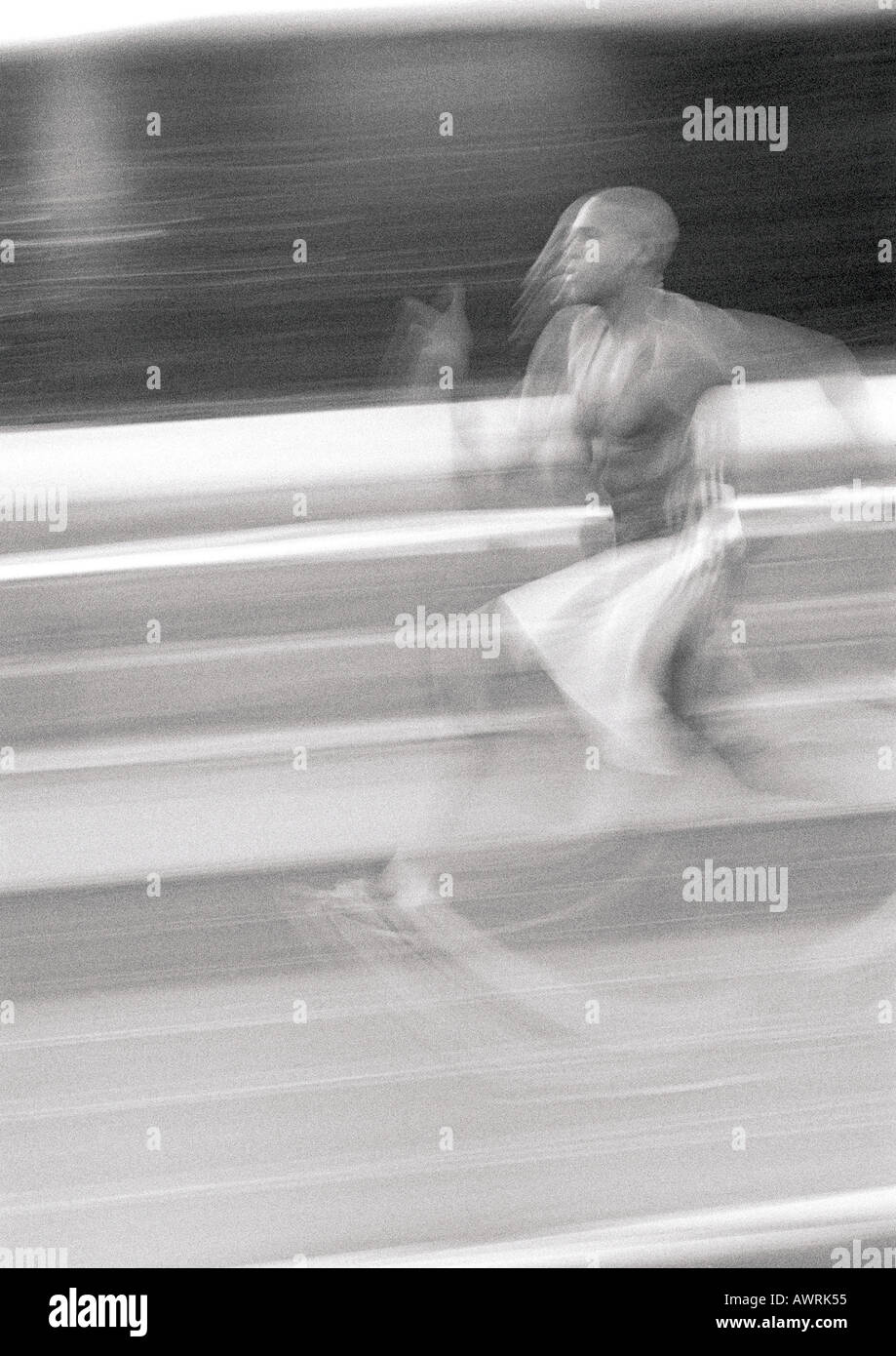 Male athlete running fast, blurred motion, b&w Stock Photo - Alamy
