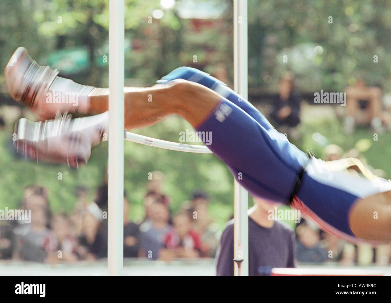 Male high jumper clearing bar Stock Photo - Alamy