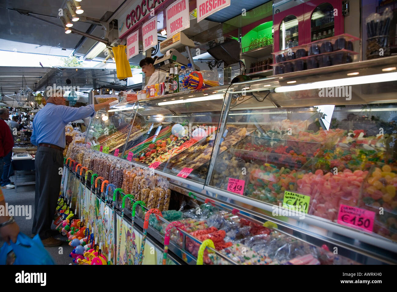 Man buying candy and sweets from mobile vendor stall at outdoor market ...